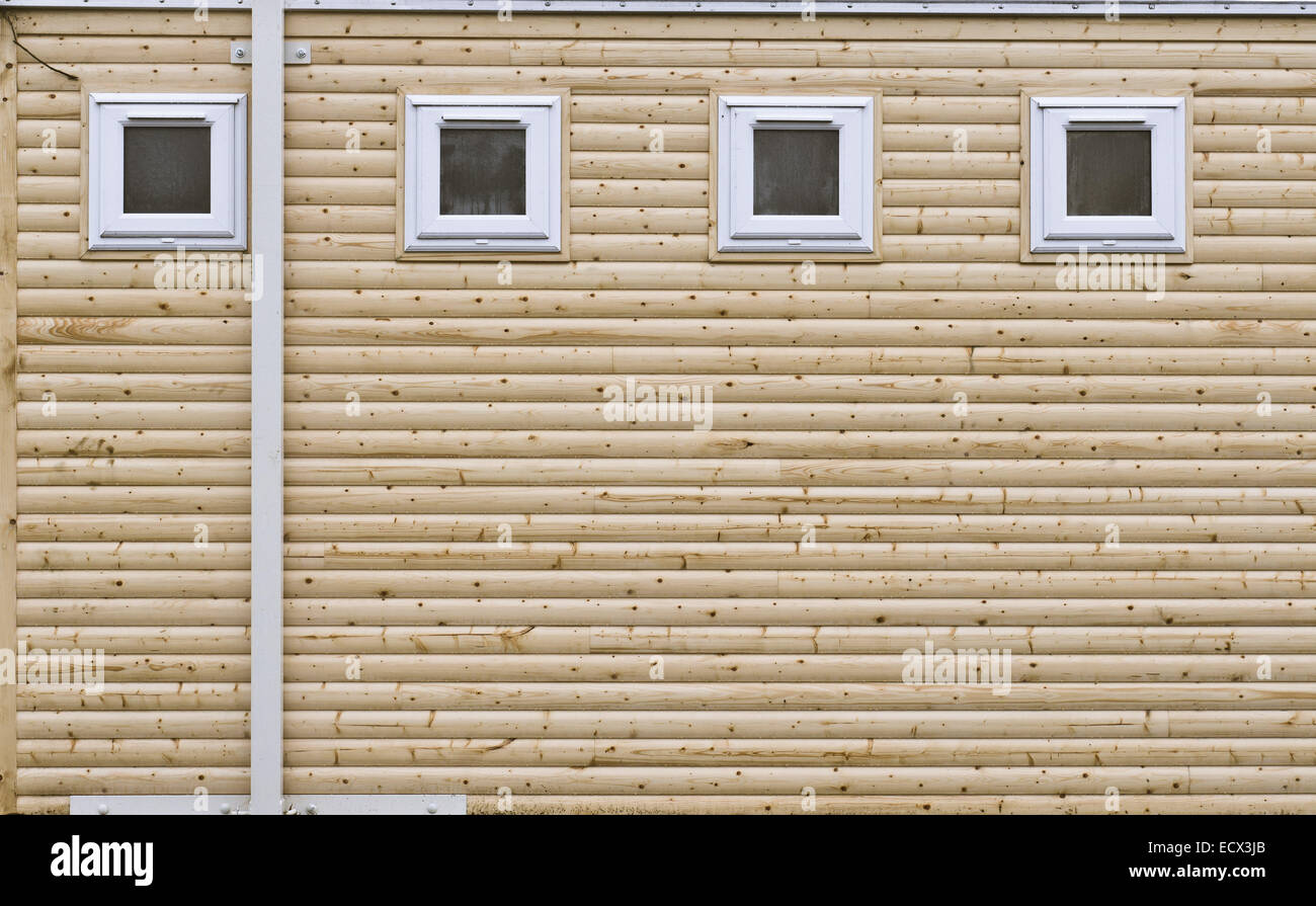 New wooden building with pvc windows Stock Photo - Alamy