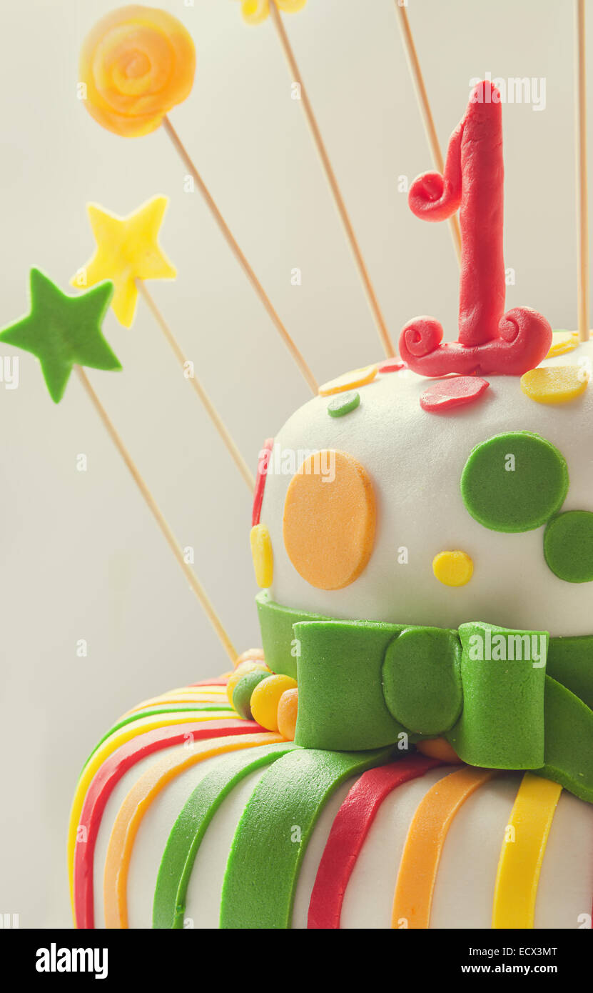 Details of birthday cake, colorful decoration and number one on top Stock Photo - Alamy