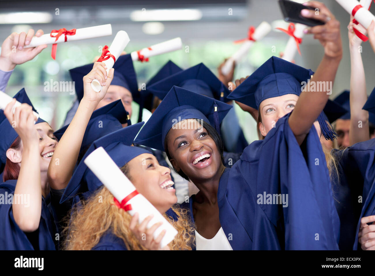 Students taking selfie after graduation ceremony Stock Photo - Alamy