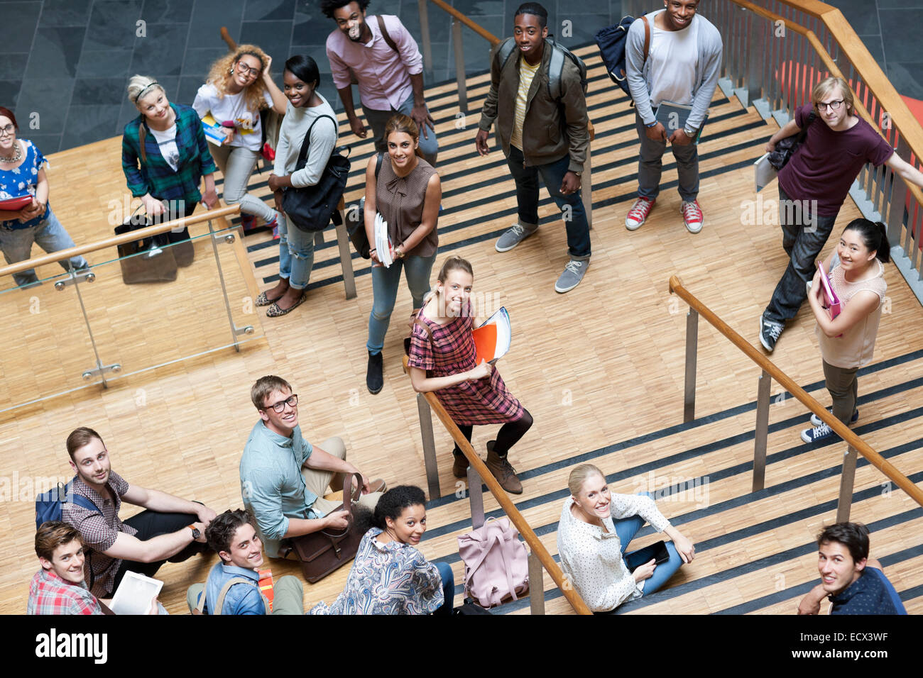 Portrait of university students standing together on staircase Stock ...