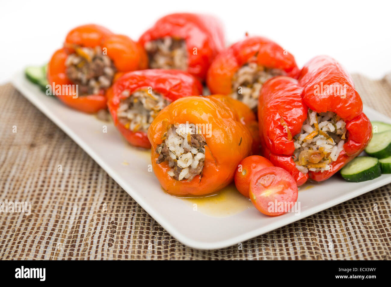 Freshly cooked peppers on a beige plate Stock Photo - Alamy