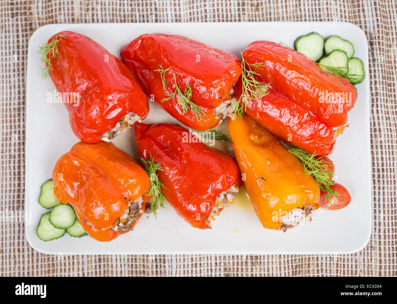Freshly cooked peppers on a beige plate Stock Photo - Alamy