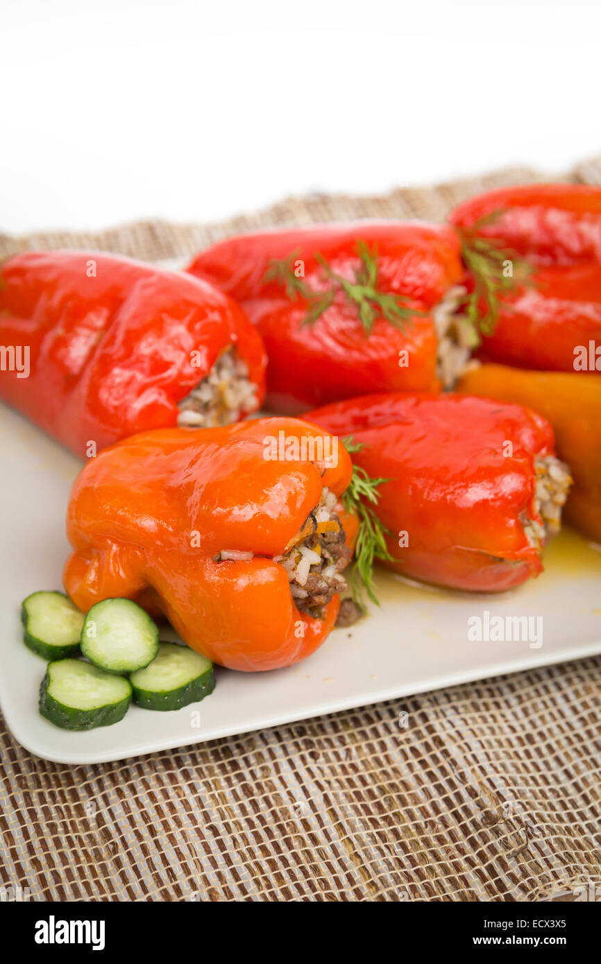 Freshly cooked peppers on a beige plate Stock Photo - Alamy