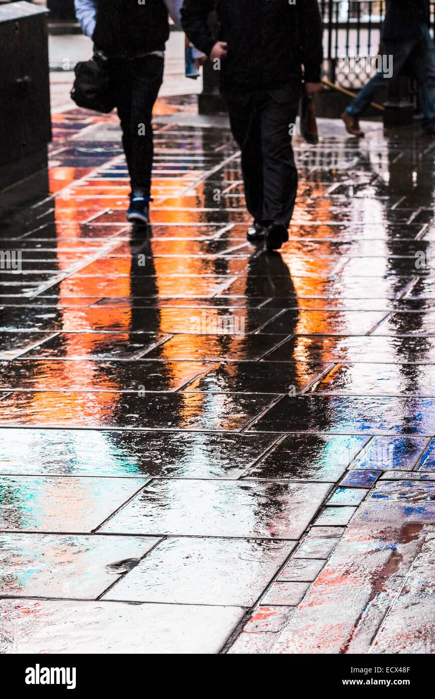 Coloured reflections on rain effected pavement - London Stock Photo - Alamy