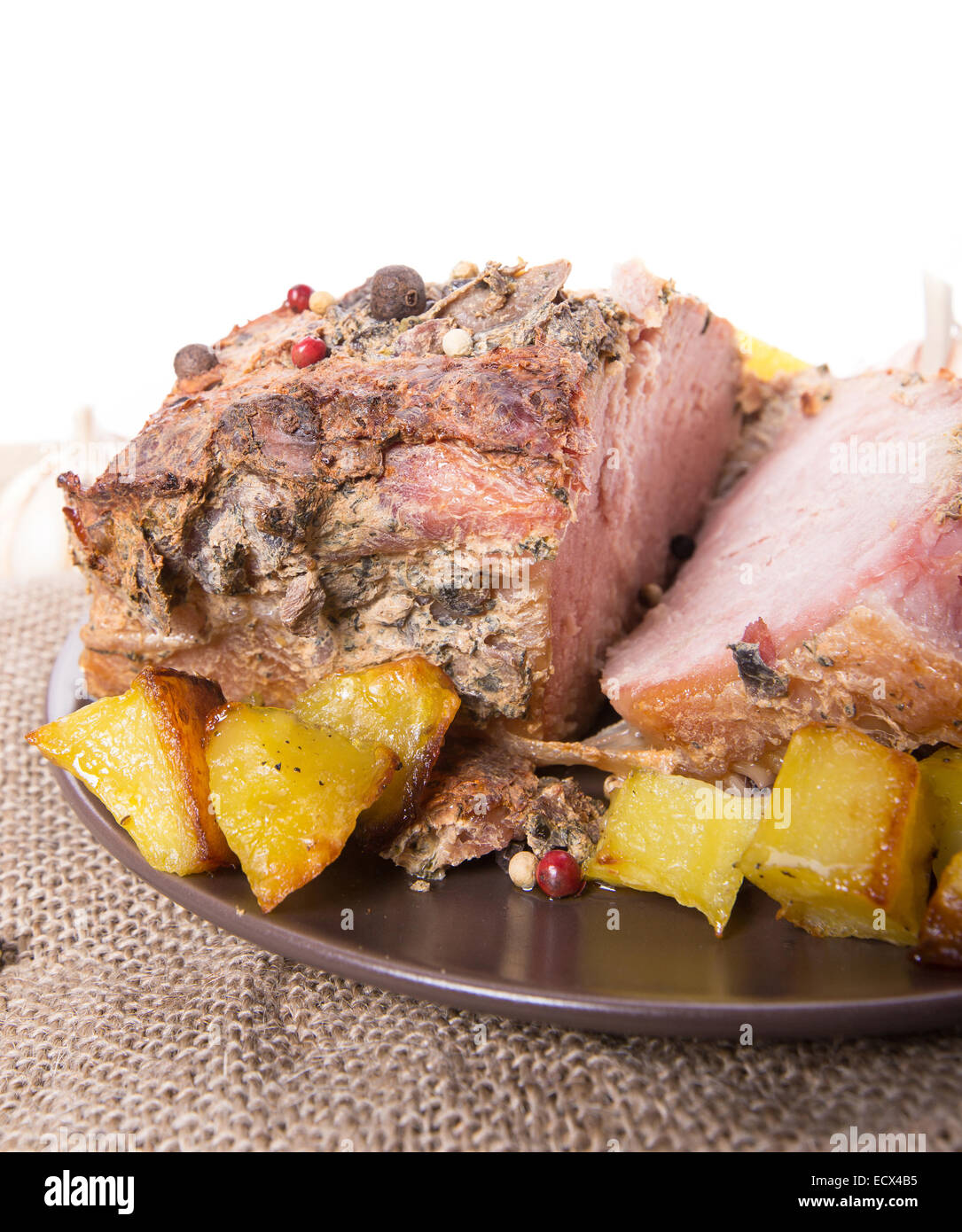 Roasted meat slices on a wooden background Stock Photo - Alamy