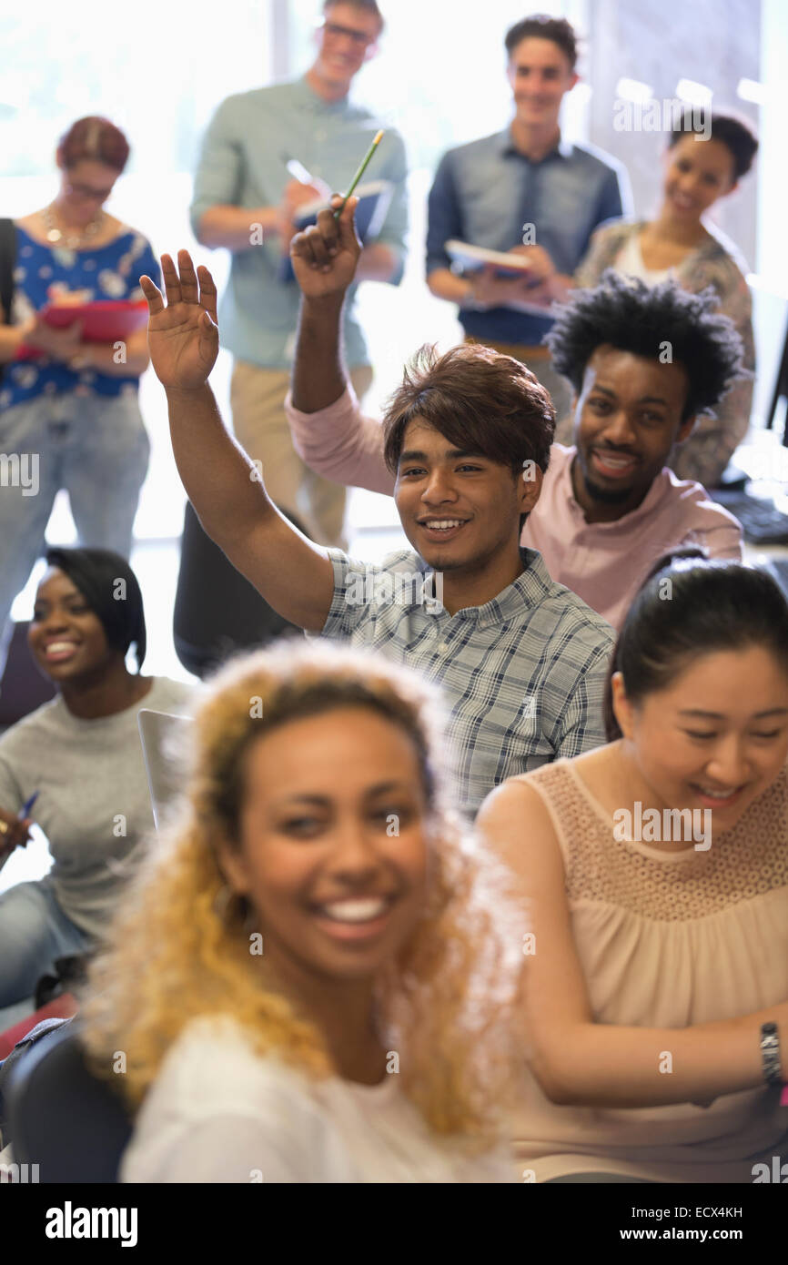 University students raising hands at IT seminar Stock Photo - Alamy