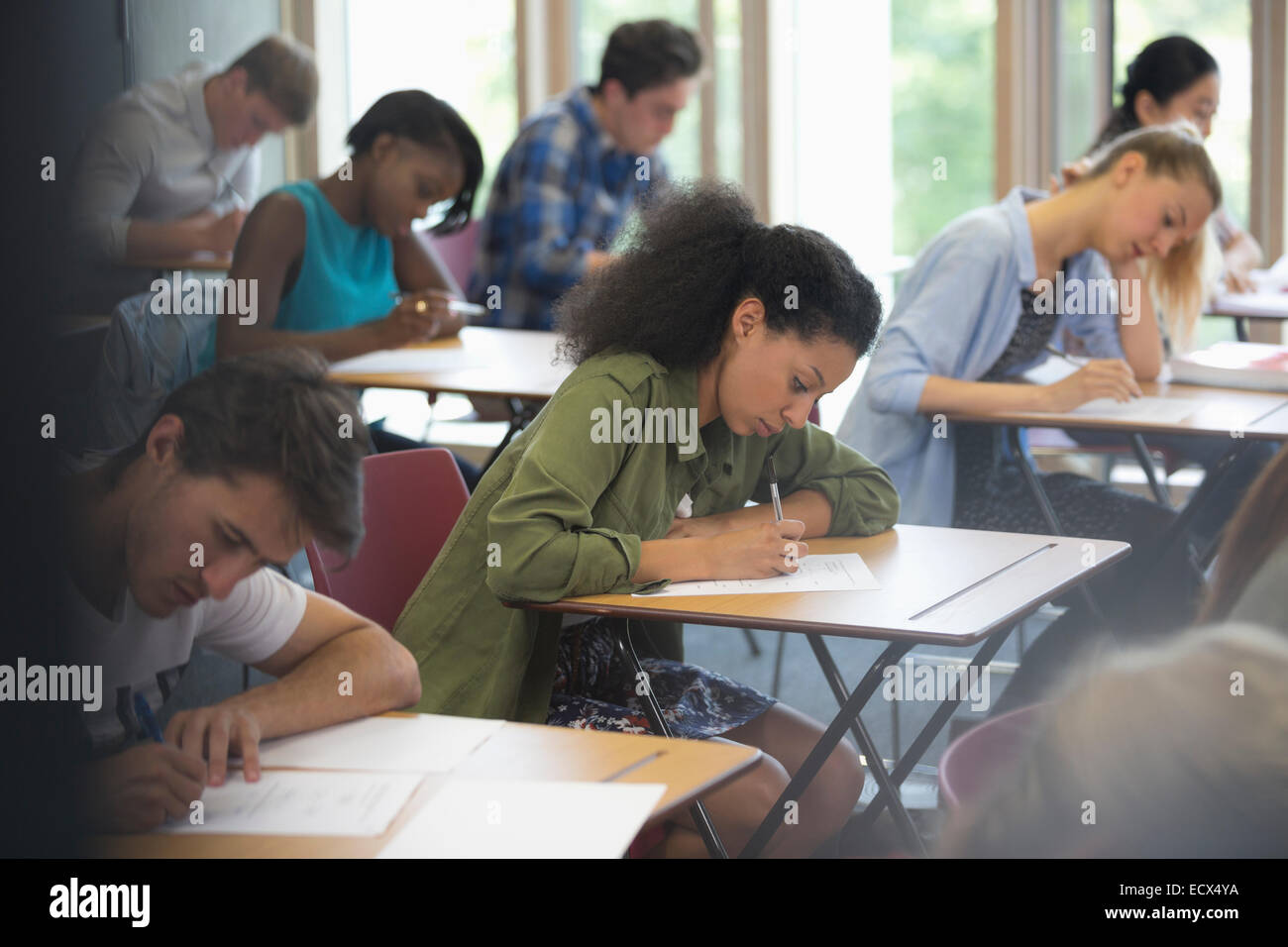 View of students sitting at desks during test in classroom Stock Photo ...