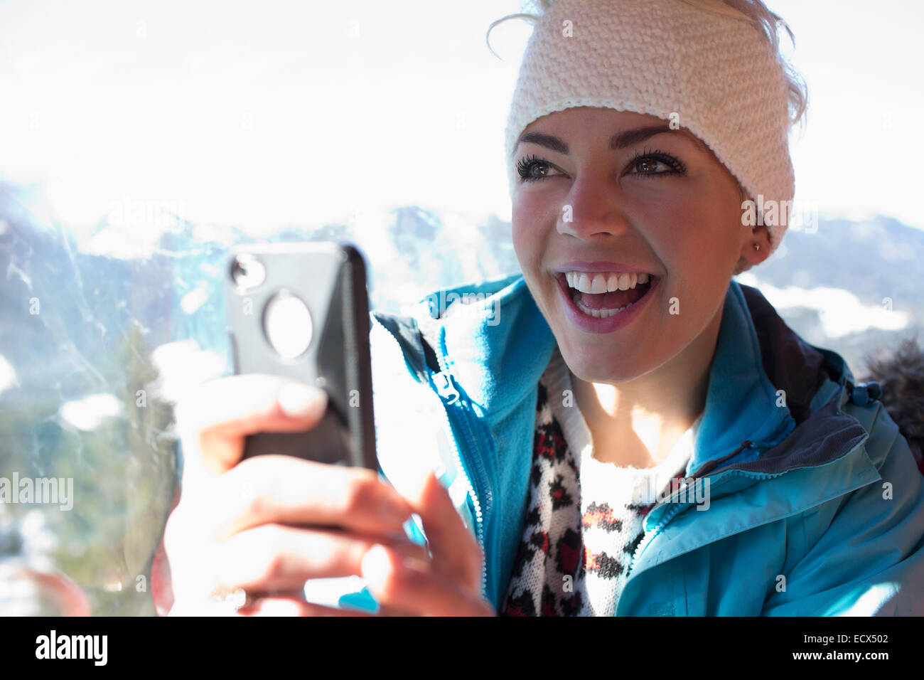 Smiling woman using cell phone Stock Photo - Alamy