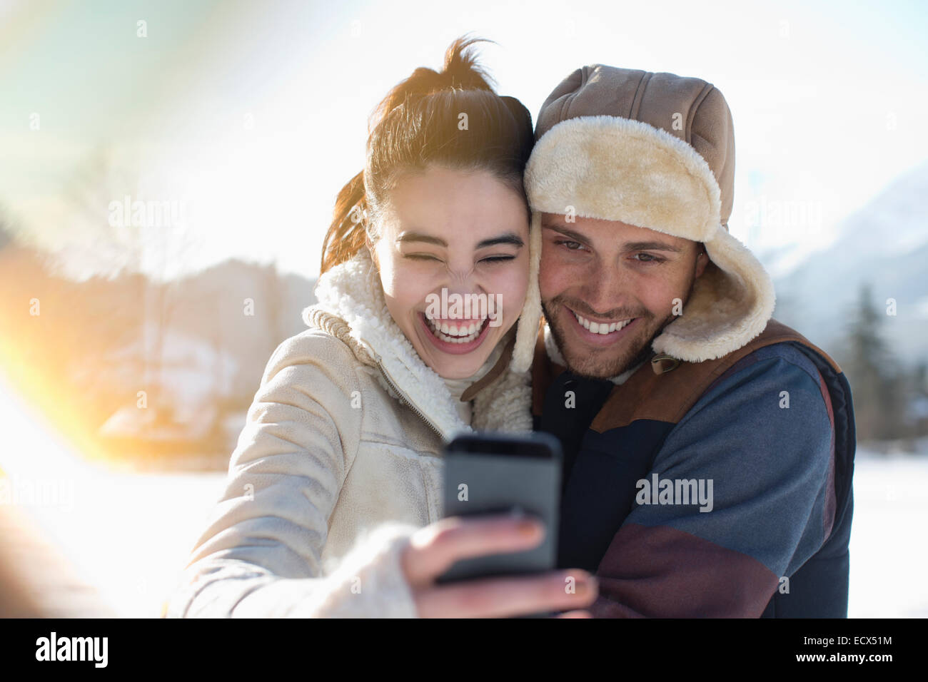 Photographing couple snow hi-res stock photography and images - Alamy