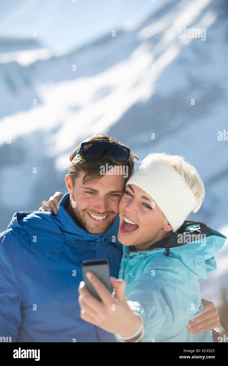 Photographing couple snow hi-res stock photography and images - Alamy