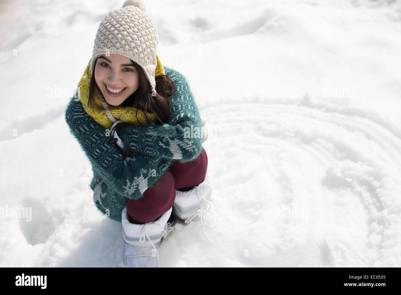 Portrait of smiling woman in snow Stock Photo - Alamy