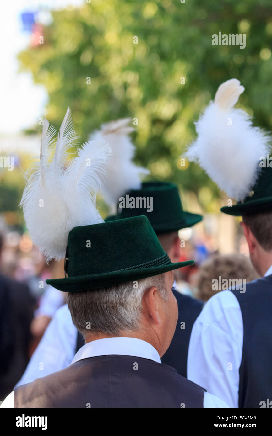Three men with traditional costume hats with white feathers in Vienna ...