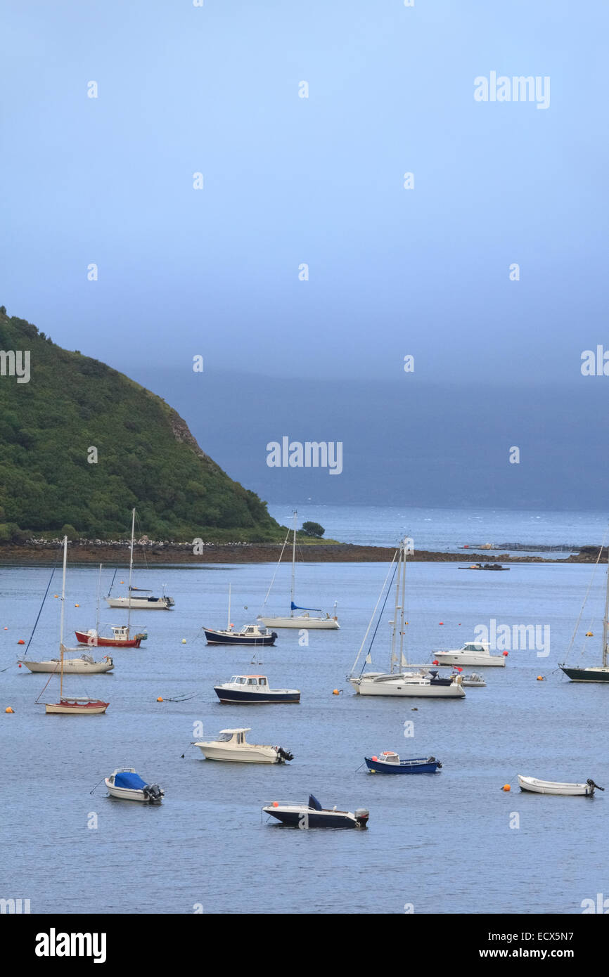 Boats lying at anchor in a bay in Portree, Scotland Stock Photo - Alamy