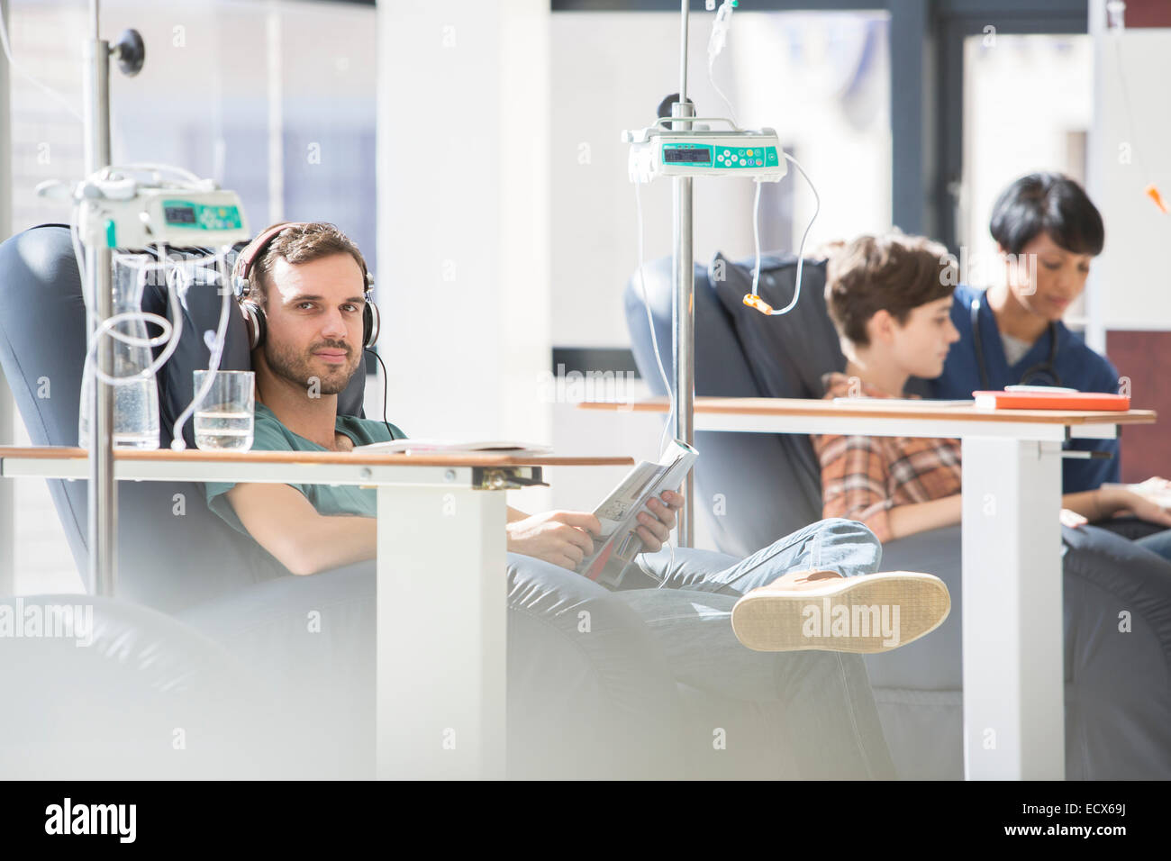 Receiving medical treatment hi-res stock photography and images - Alamy