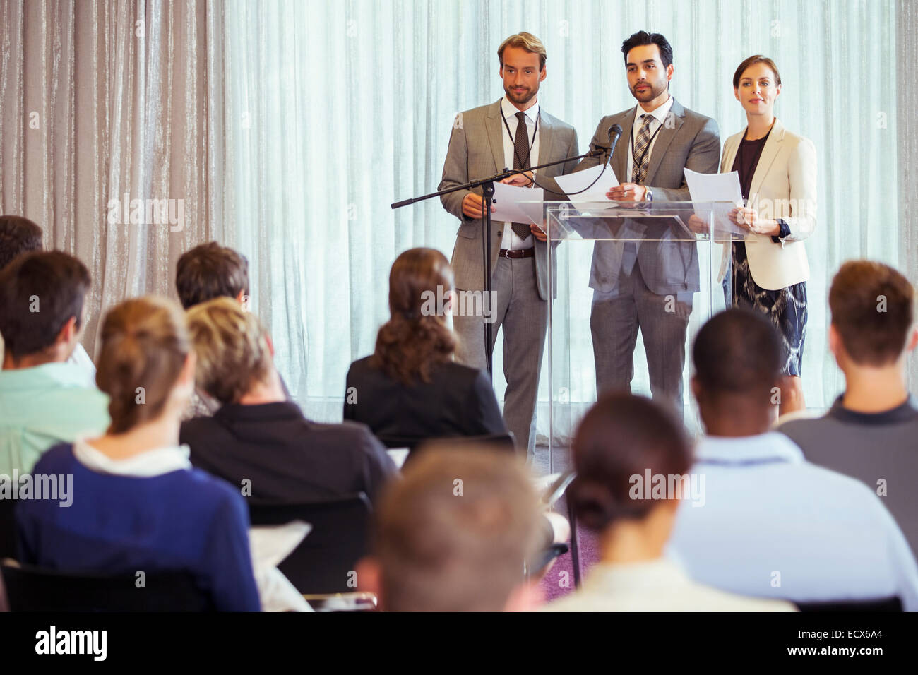 Business people giving presentation in conference room Stock Photo - Alamy