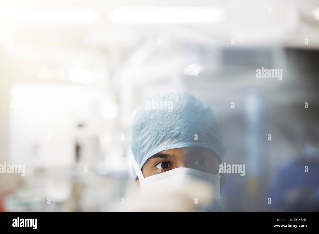 Portrait of surgeon wearing surgical cap and mask Stock Photo - Alamy