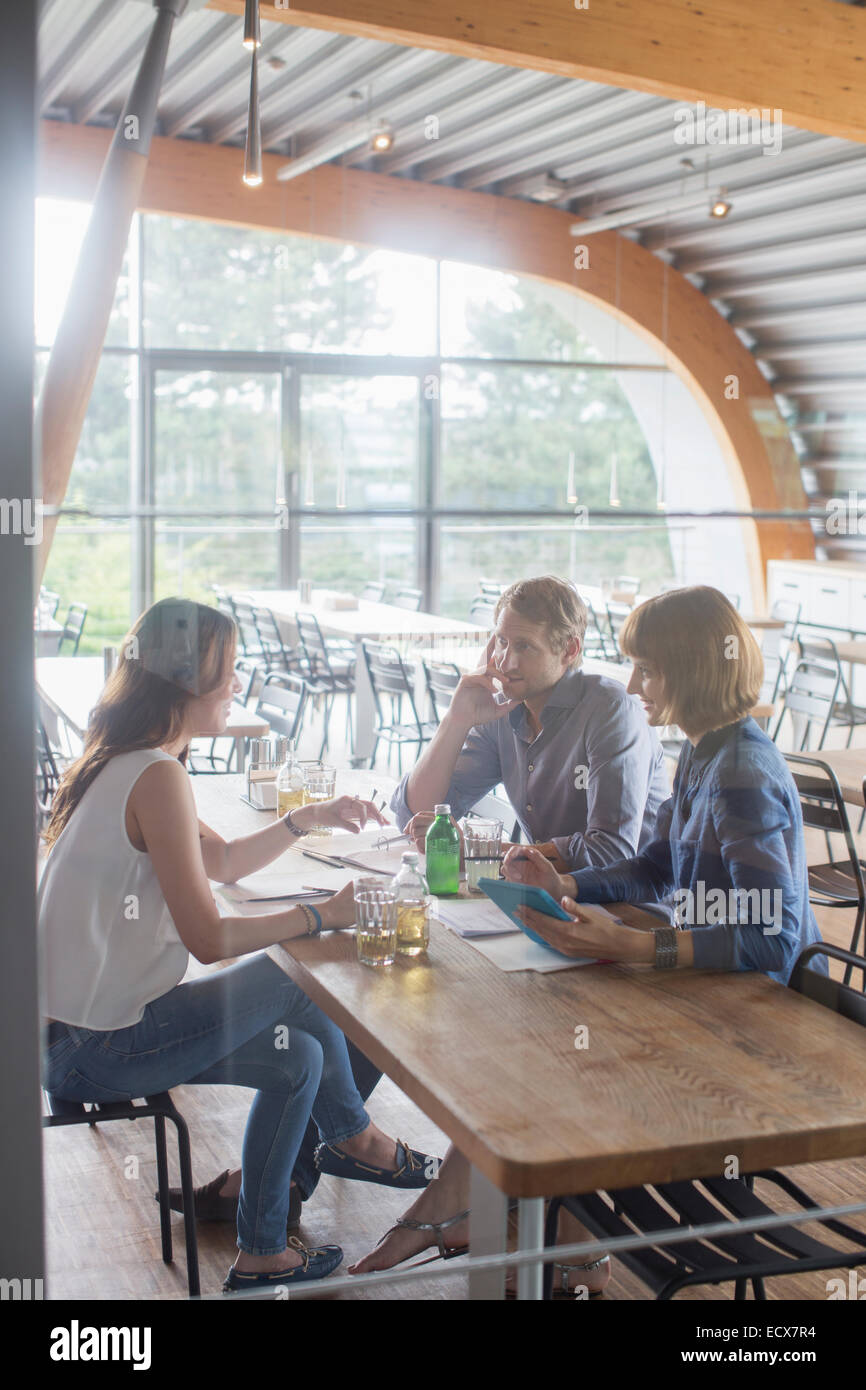 Business people talking in cafeteria Stock Photo - Alamy
