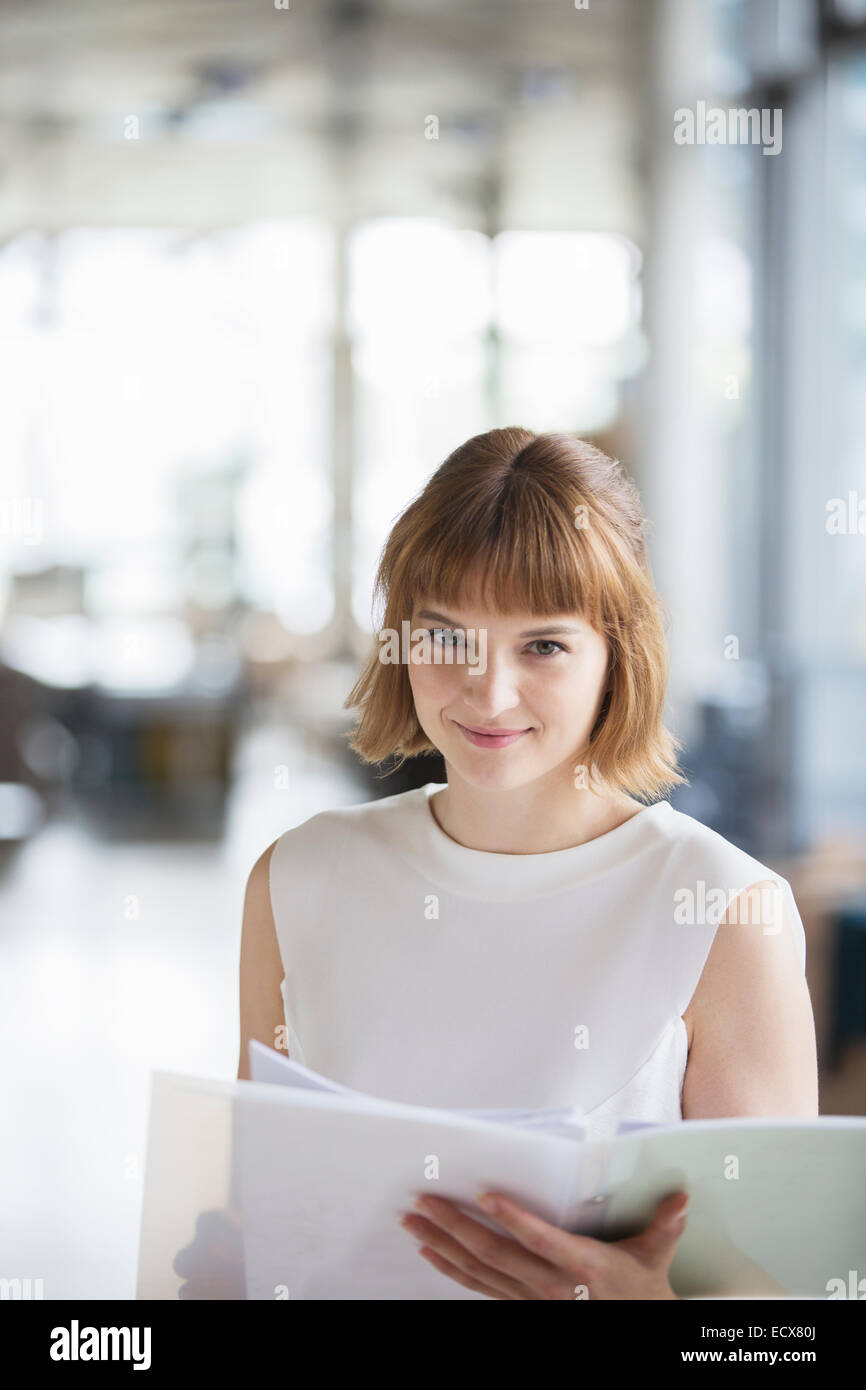 Office woman reading paperwork hi-res stock photography and images - Alamy