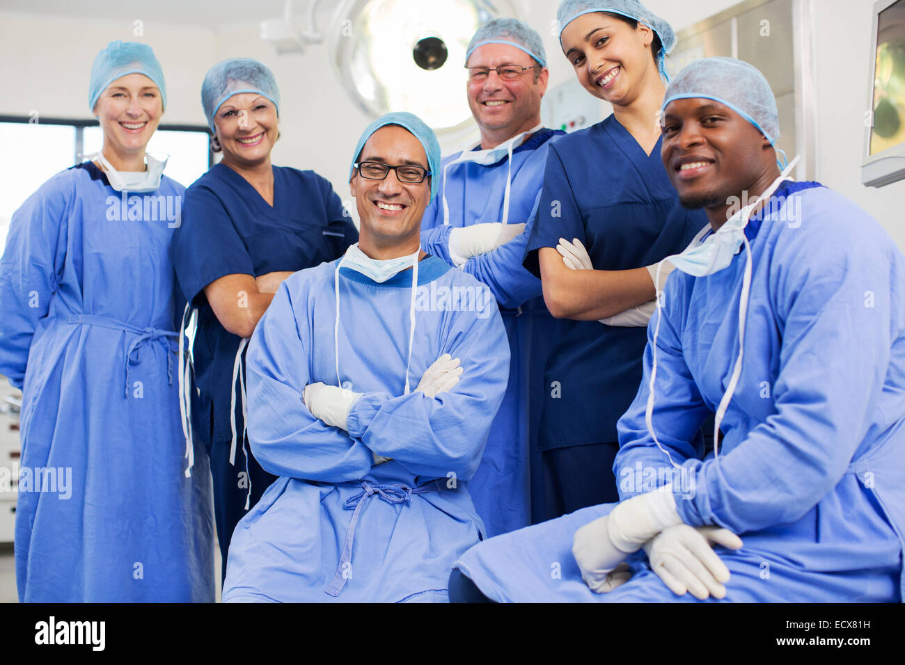 Group portrait of surgeons posing in operating theater Stock Photo - Alamy