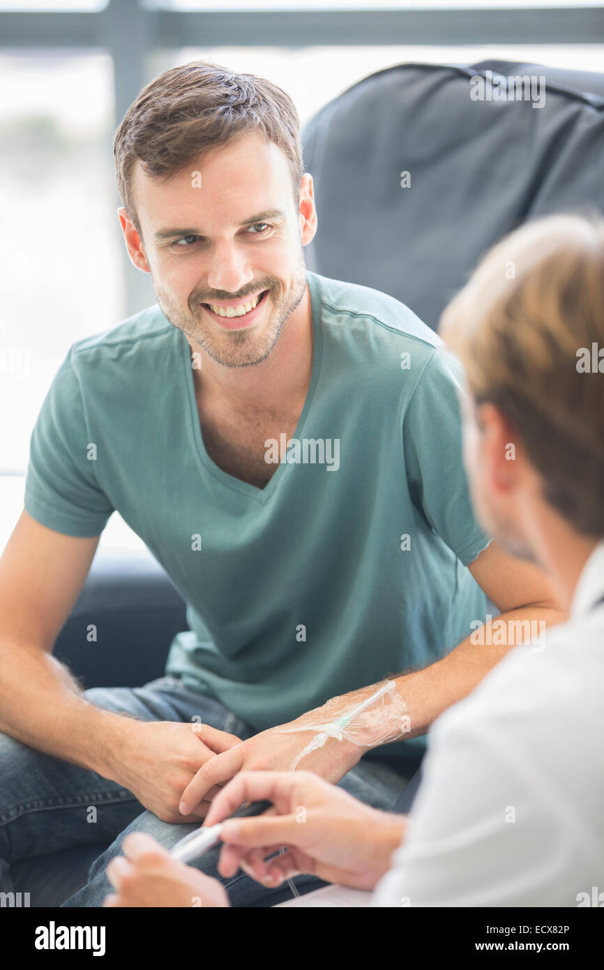 Doctor talking to patient in hospital Stock Photo - Alamy