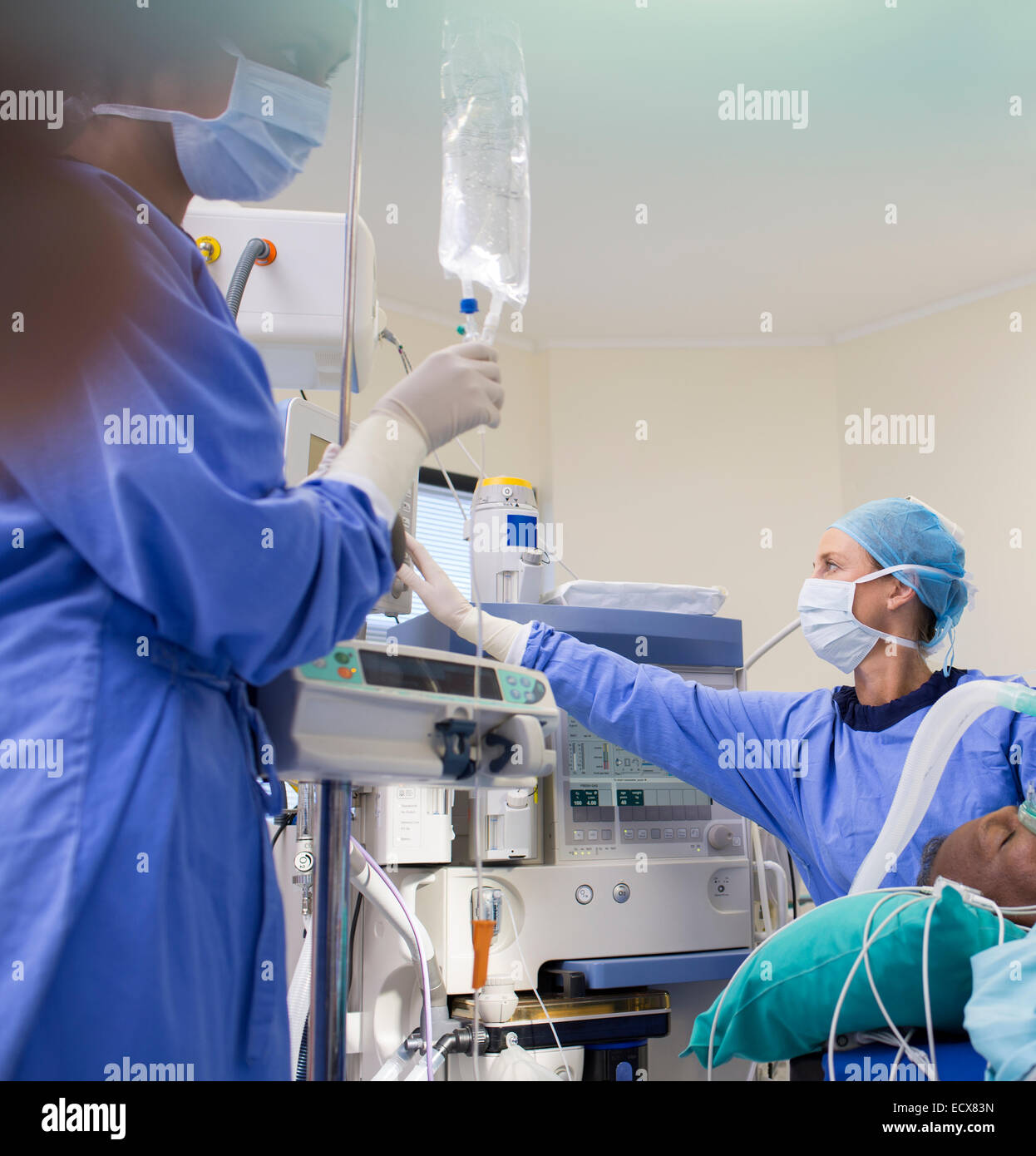 Two surgeons preparing medical equipment for operation Stock Photo - Alamy