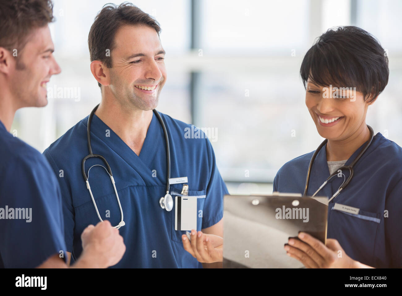 Team of doctors laughing in hospital Stock Photo - Alamy