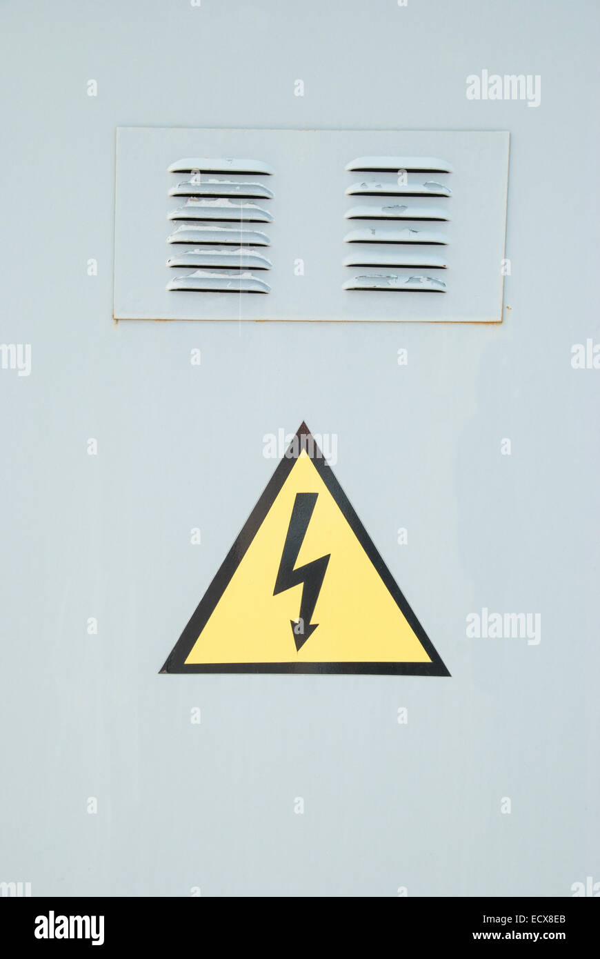 Yellow electric emergency sign with gray background Stock Photo - Alamy
