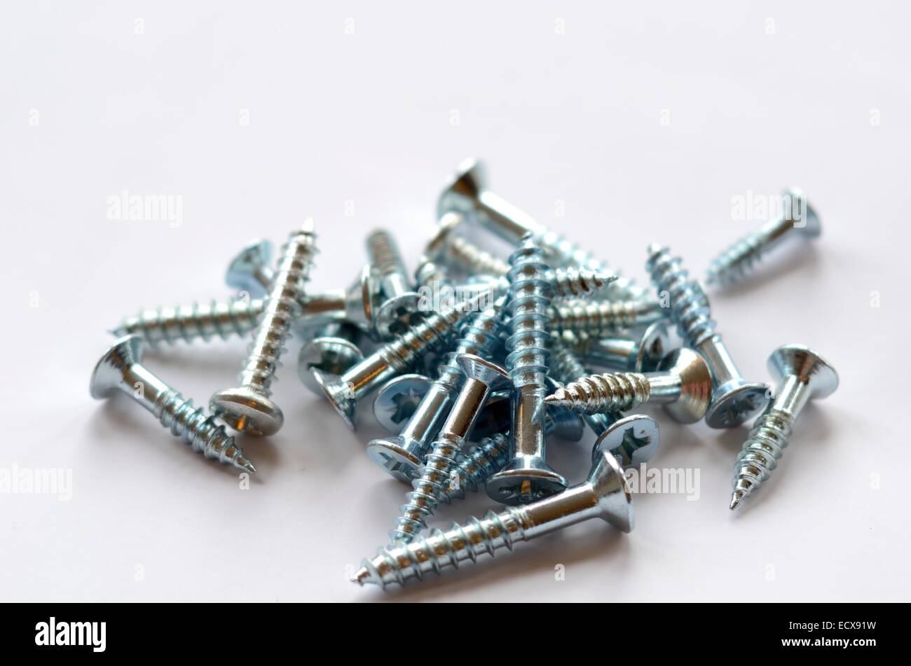 A pile of screws, silver colour Stock Photo - Alamy