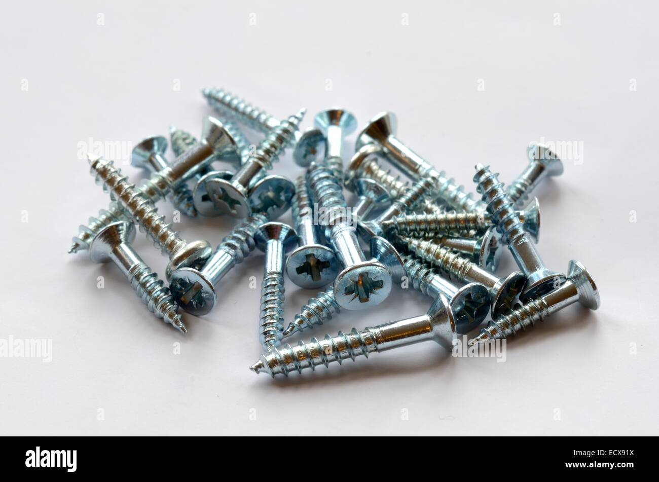 A pile of screws, silver colour Stock Photo - Alamy