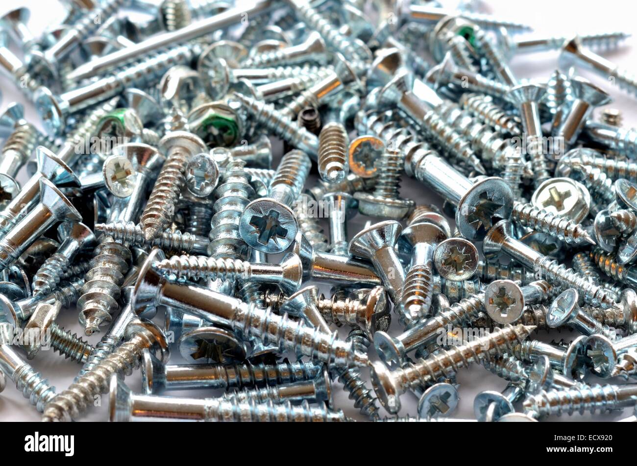 A pile of screws, silver colour Stock Photo - Alamy