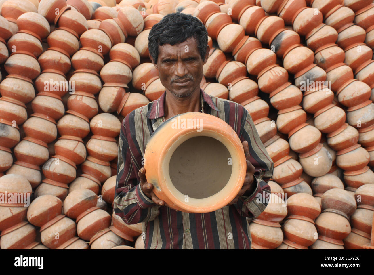 A mud pot seller store-keeping for sale at river bank of Rayer Bazar in ...