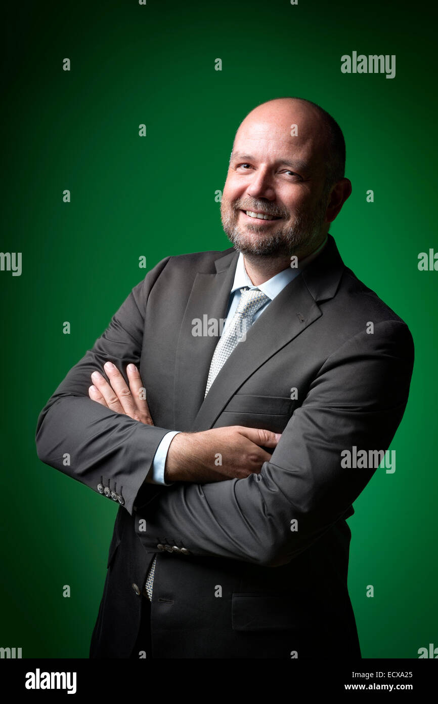 Image of a businessman with a bald head and beard against a green ...