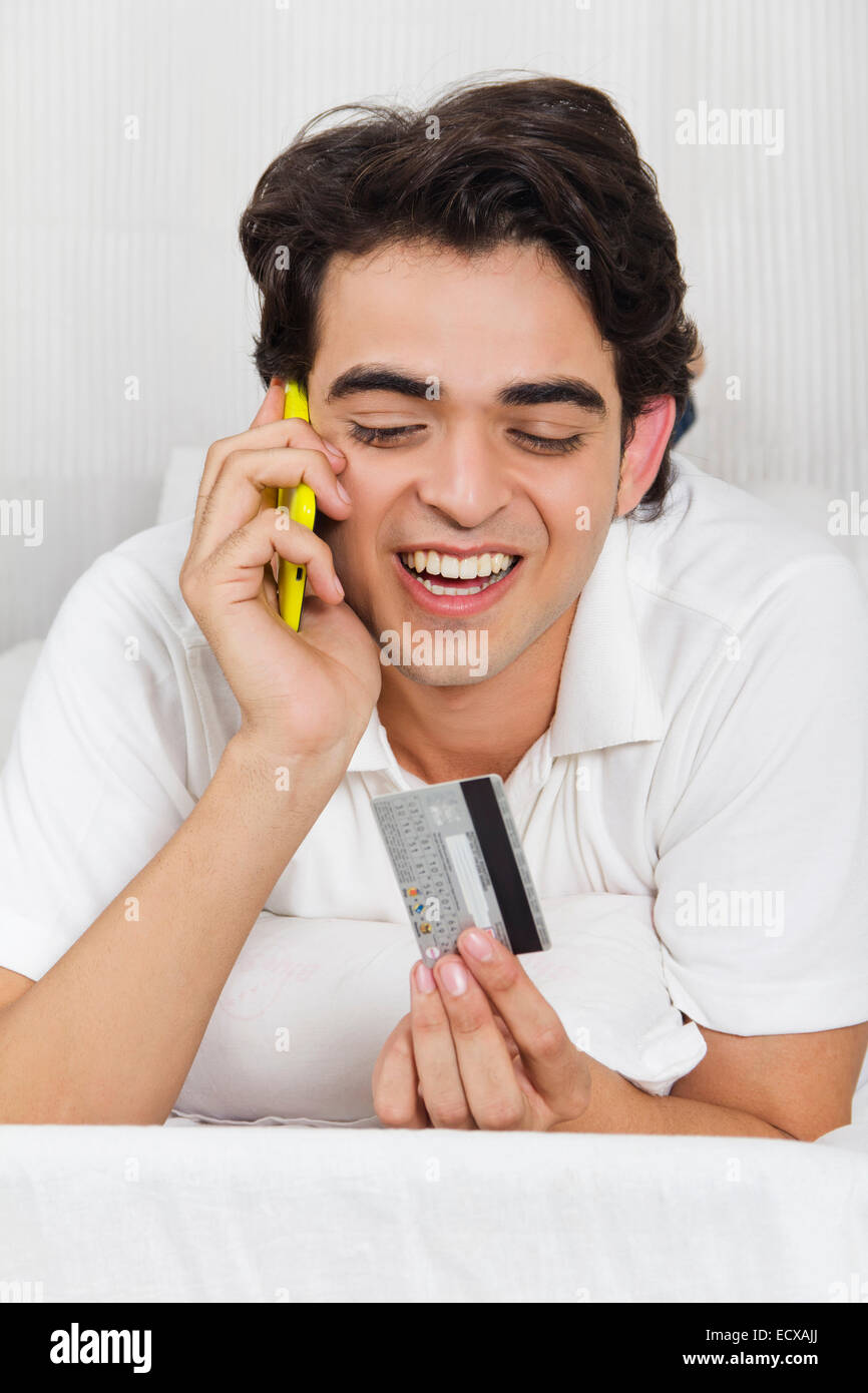 1 indian boy phone talking with Credit Card Stock Photo - Alamy