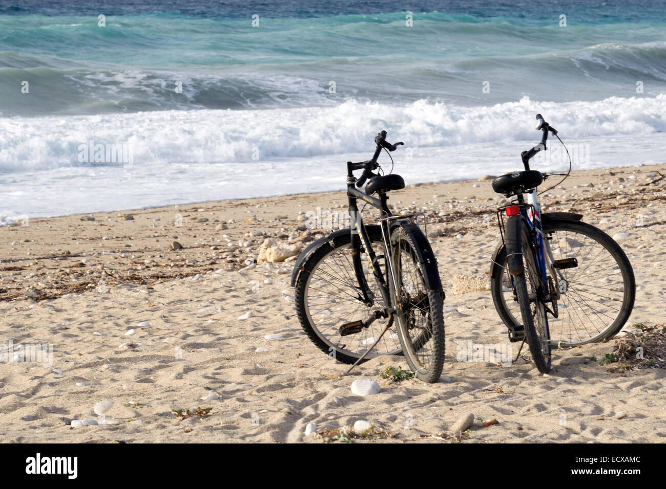 Two bicycles on the beach Stock Photo - Alamy
