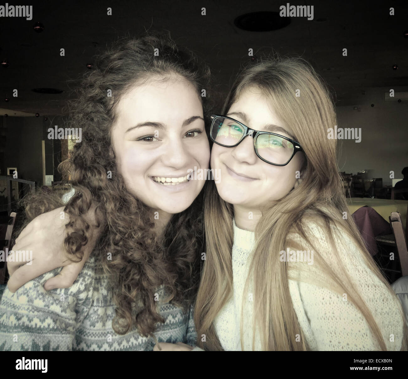 two pretty girls are smiling in camera Stock Photo - Alamy