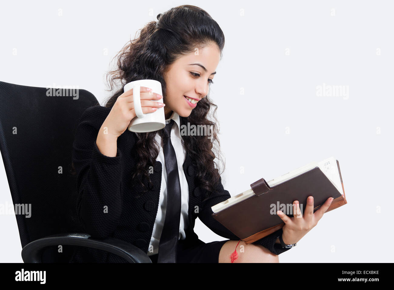 1 indian Business woman reading Diary Stock Photo - Alamy
