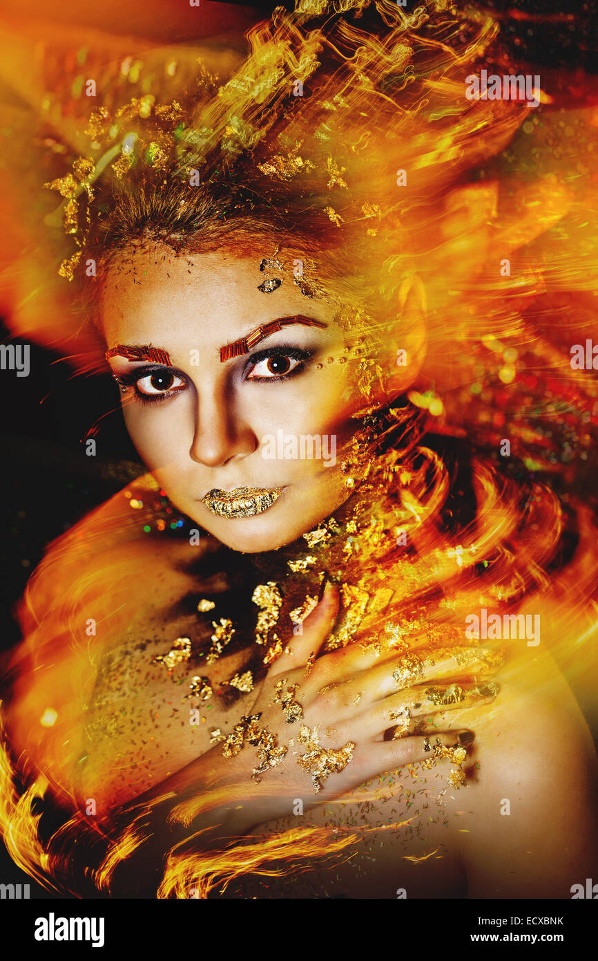 Woman with golden make-up Stock Photo - Alamy