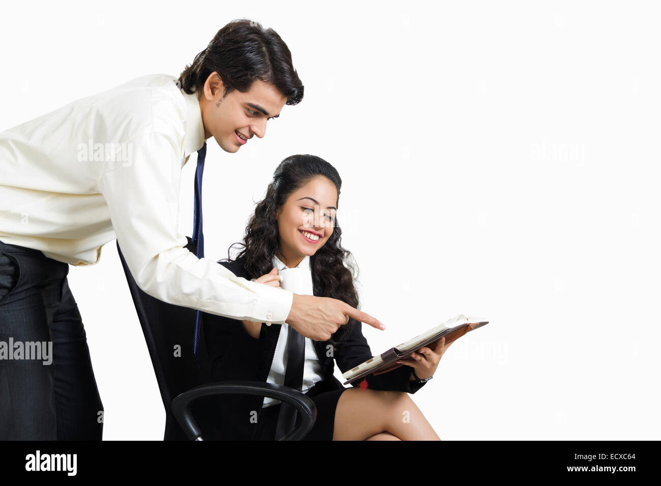 2 indian Business Colleague Employee reading diary Stock Photo - Alamy