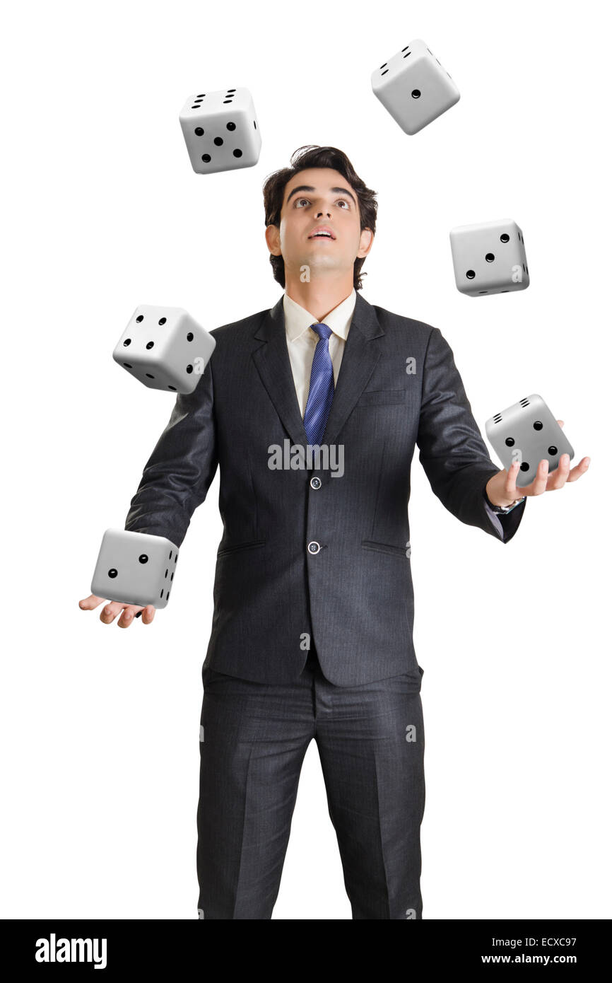 1 indian Business man playing Dice Stock Photo - Alamy