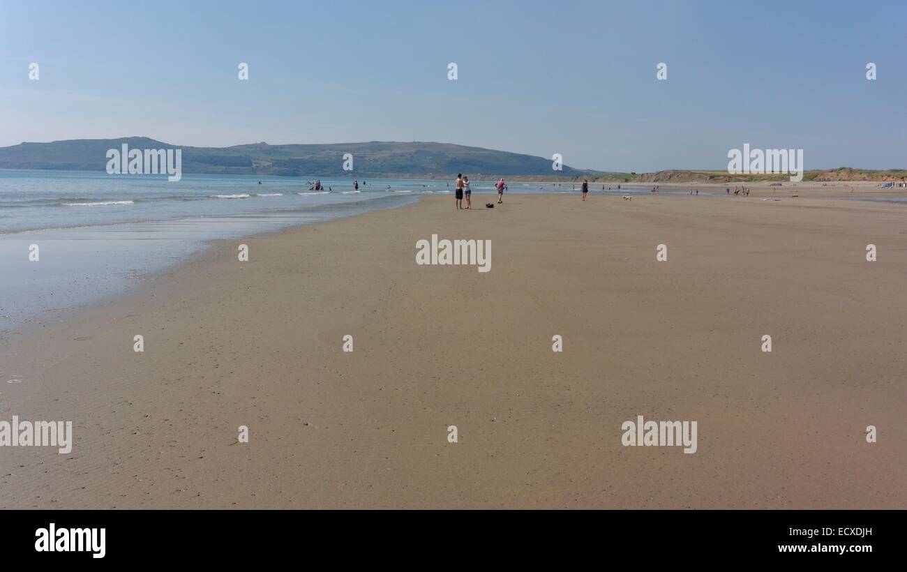 A sunny day on the beach in mid summer Stock Photo - Alamy