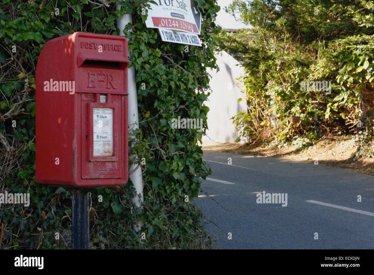 A Royal Mail pedestal post box on the corner of a lane in a Welsh ...