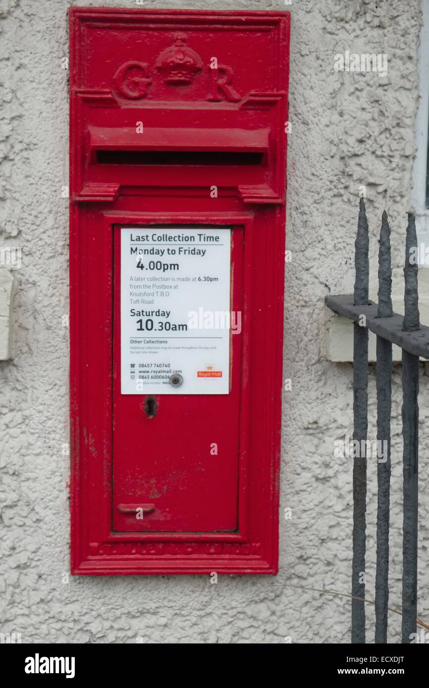 An old cast iron post box set into a cottage wall in rural Wales. "G R ...