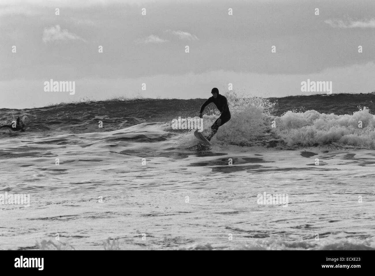 Good sea conditions allows a surfer to ride a good wave for a long run ...