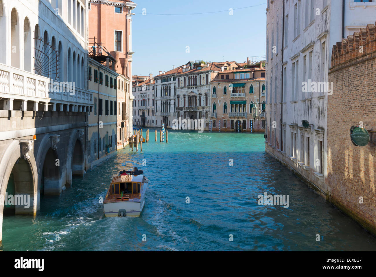 A sunny canal scene with a water taxi in Venice, Italy Stock Photo - Alamy