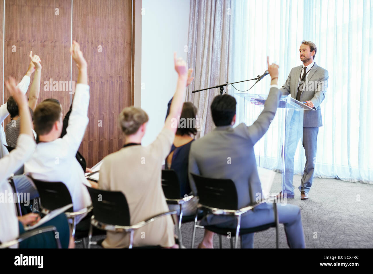 People at seminar raising hands to ask questions Stock Photo - Alamy