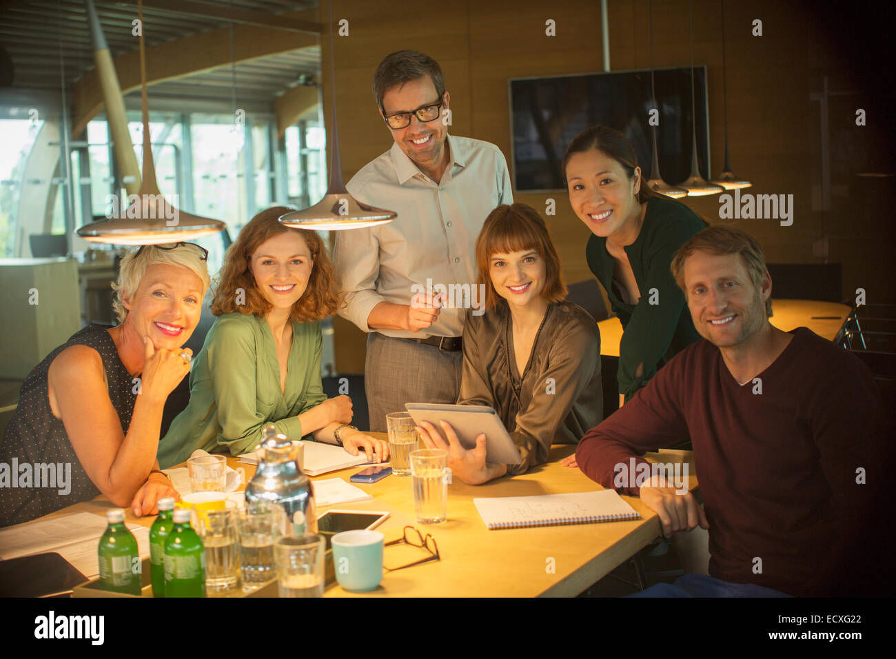 Business people smiling in office meeting Stock Photo - Alamy