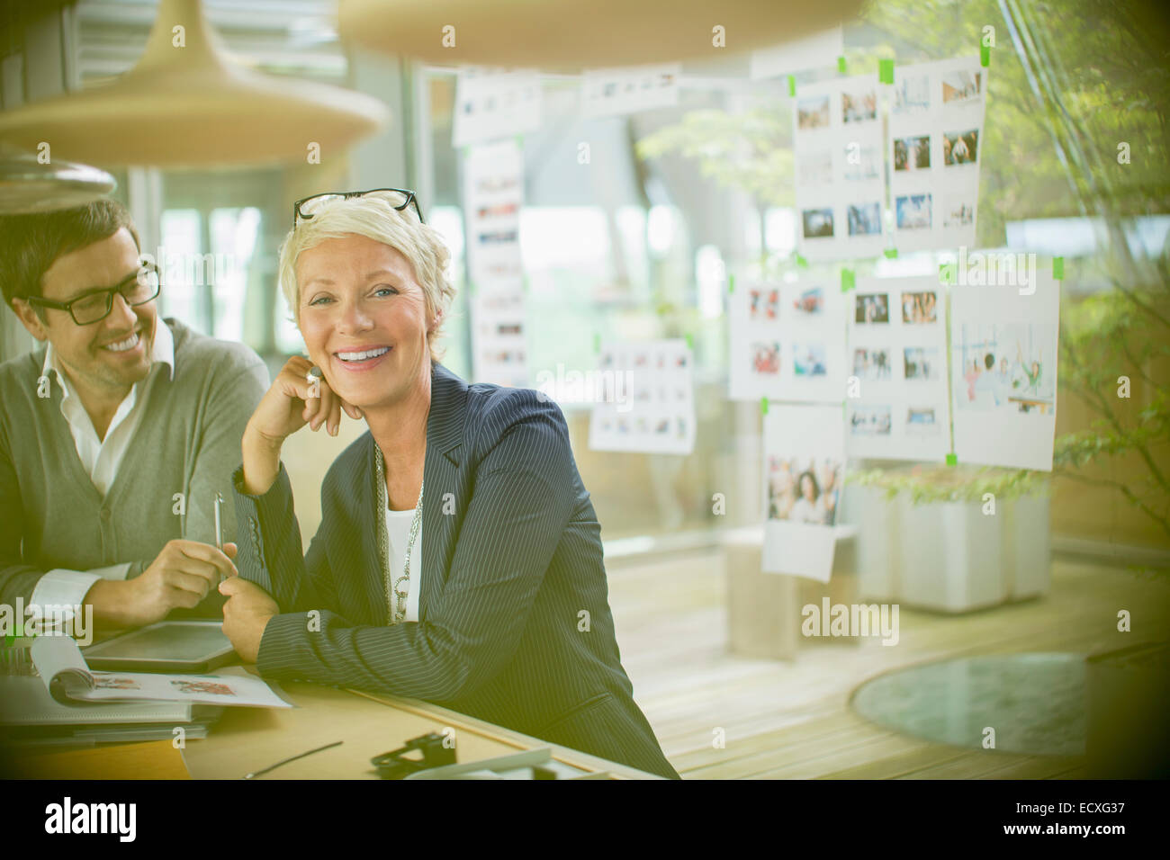 Business people smiling in office Stock Photo - Alamy