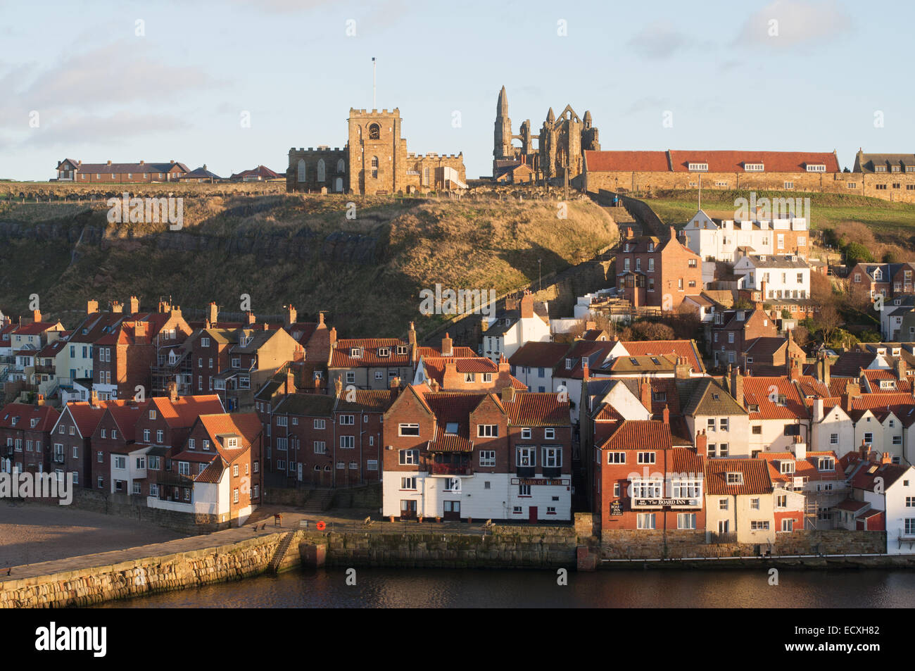 Whitby church and Abbey seen in warm winter sunlight, North Yorkshire ...
