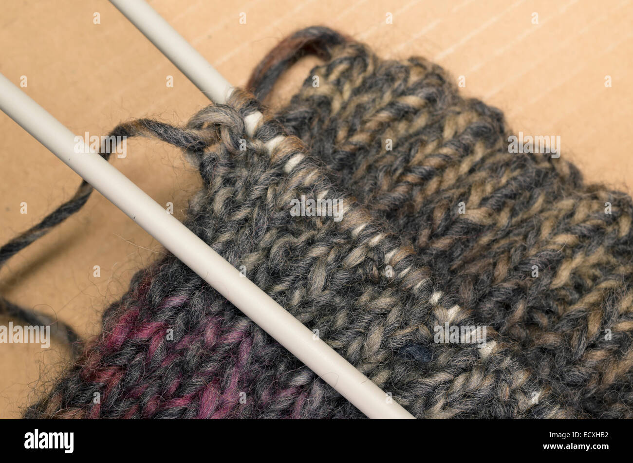 hand made melange colored wool knitted fabric close up Stock Photo - Alamy