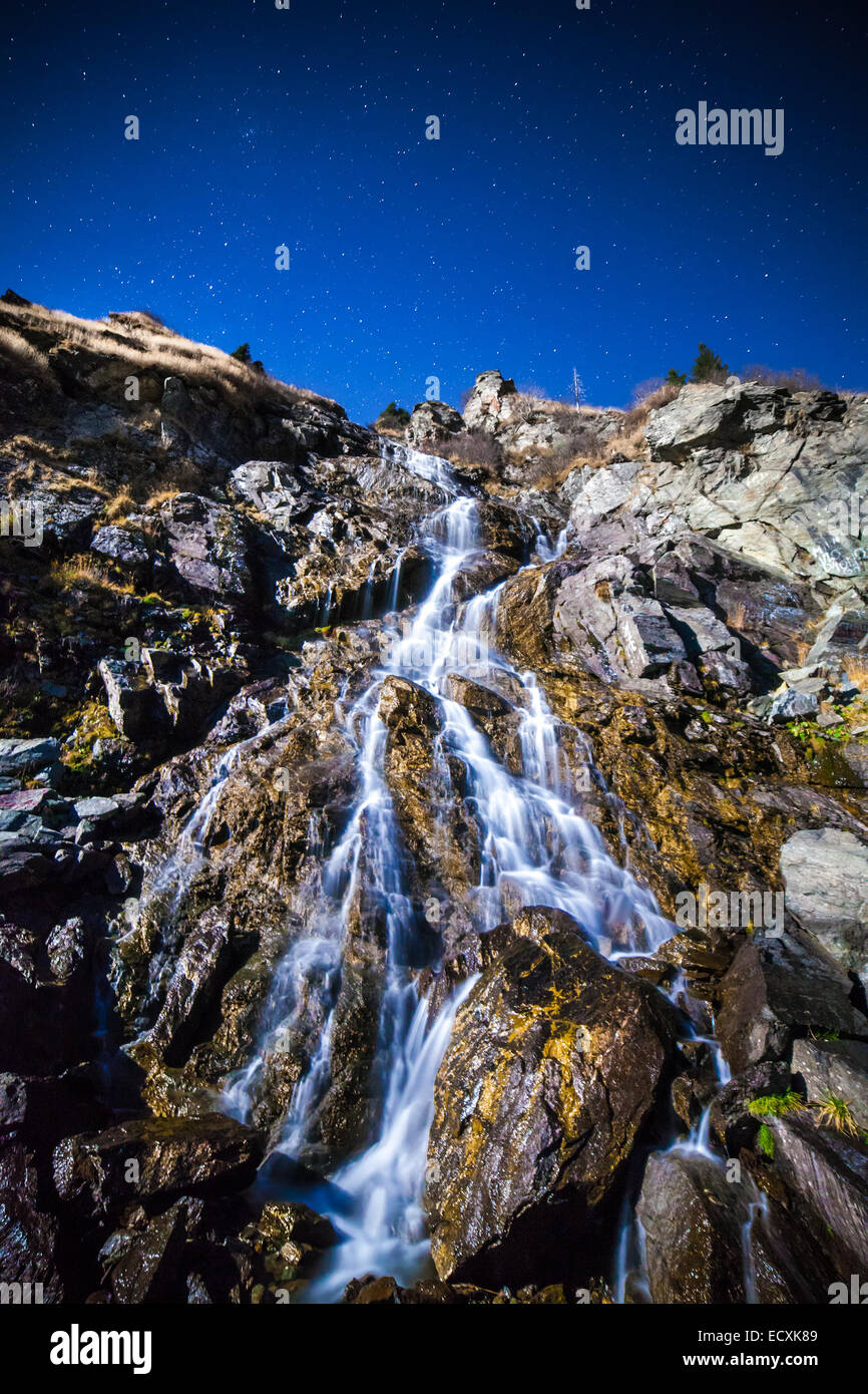 Landscape with a waterfall at night under sky with stars Stock Photo ...